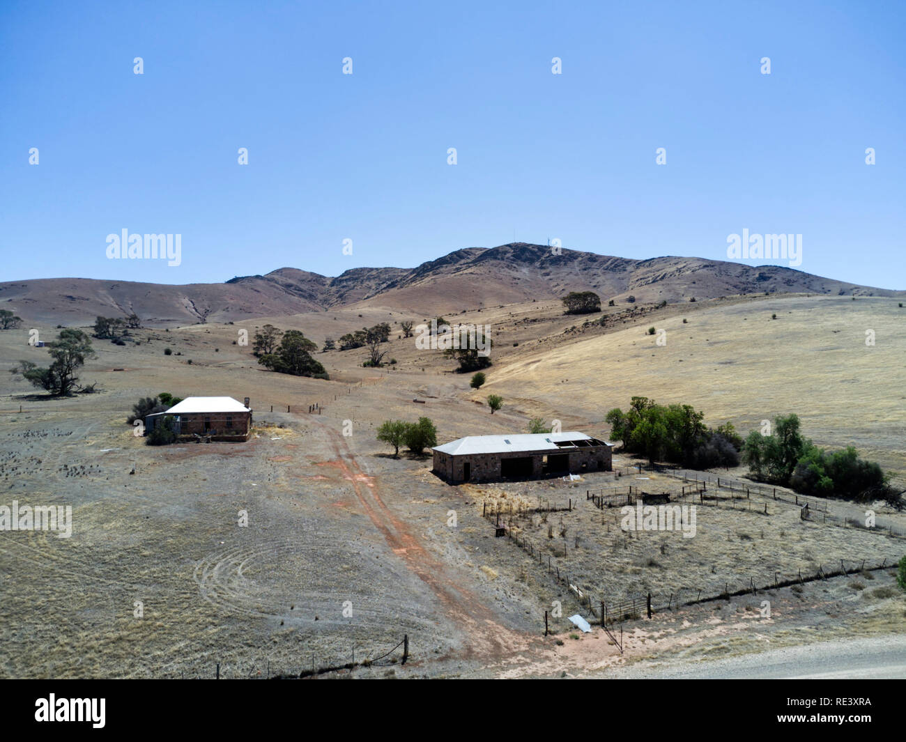 Aerial of abandoned pioneer farmhouse and shearing shed at Mount Bryan ...