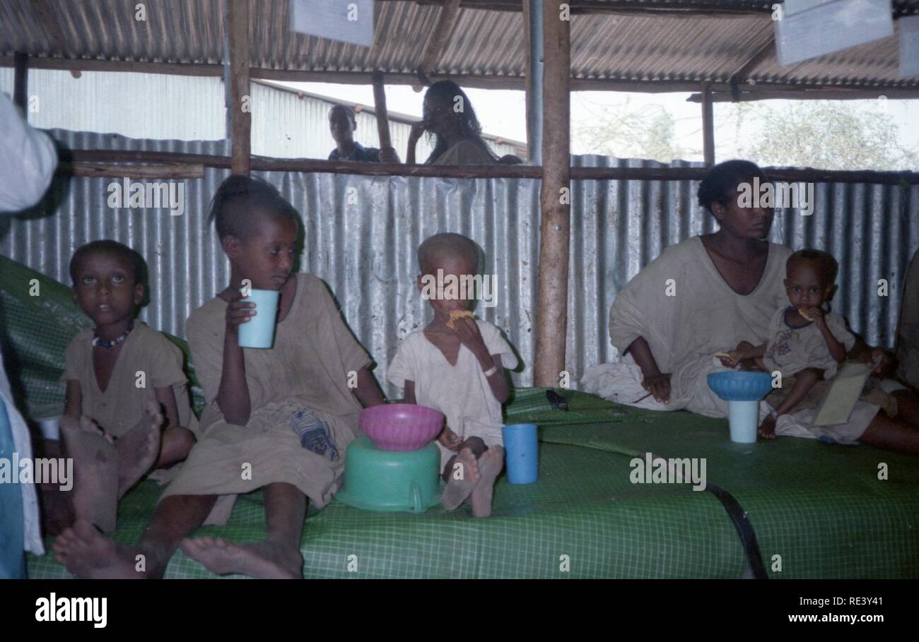 FOUR SMALL SICK CHILDREN SITTING AND EATING Stock Photo - Alamy