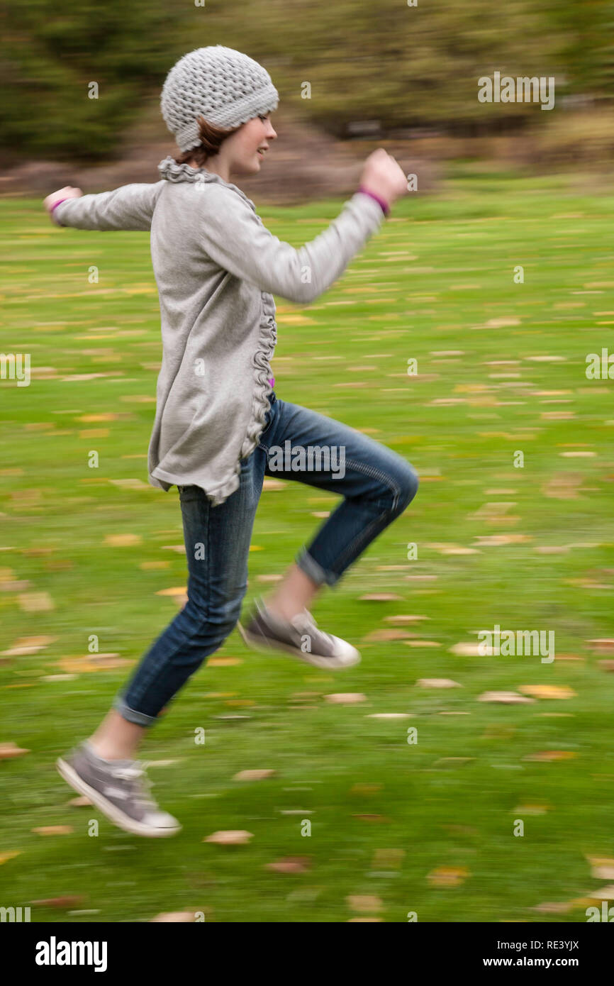 Young girl skipping in her backyard, USA Stock Photo - Alamy