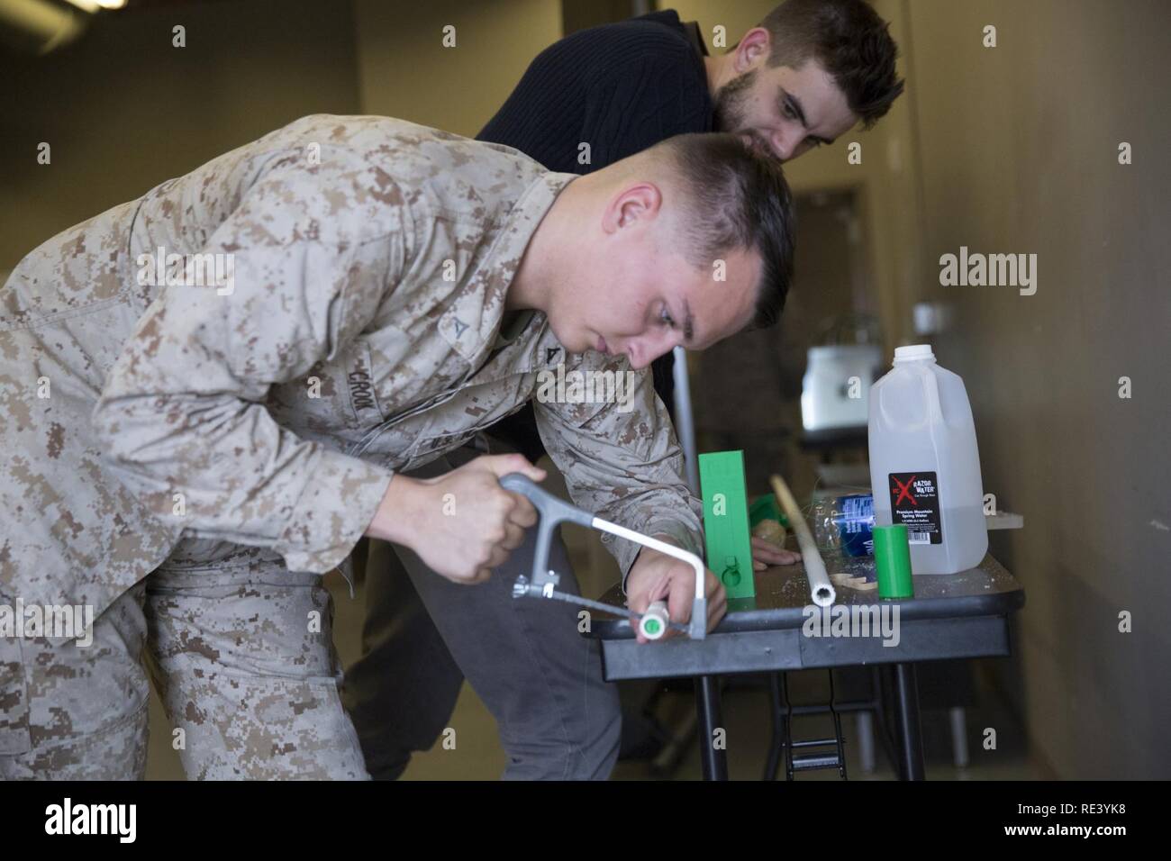 Lance Cpl. Tyler Crook, machinist, Combat Logistics Company 13, saws ...