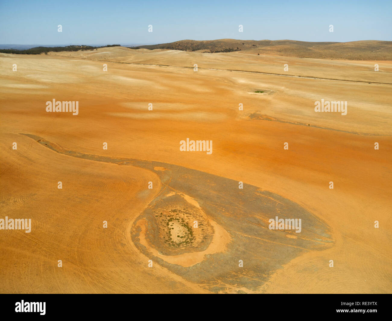Aerial view of a dry desert landscape with unique geological formations ...
