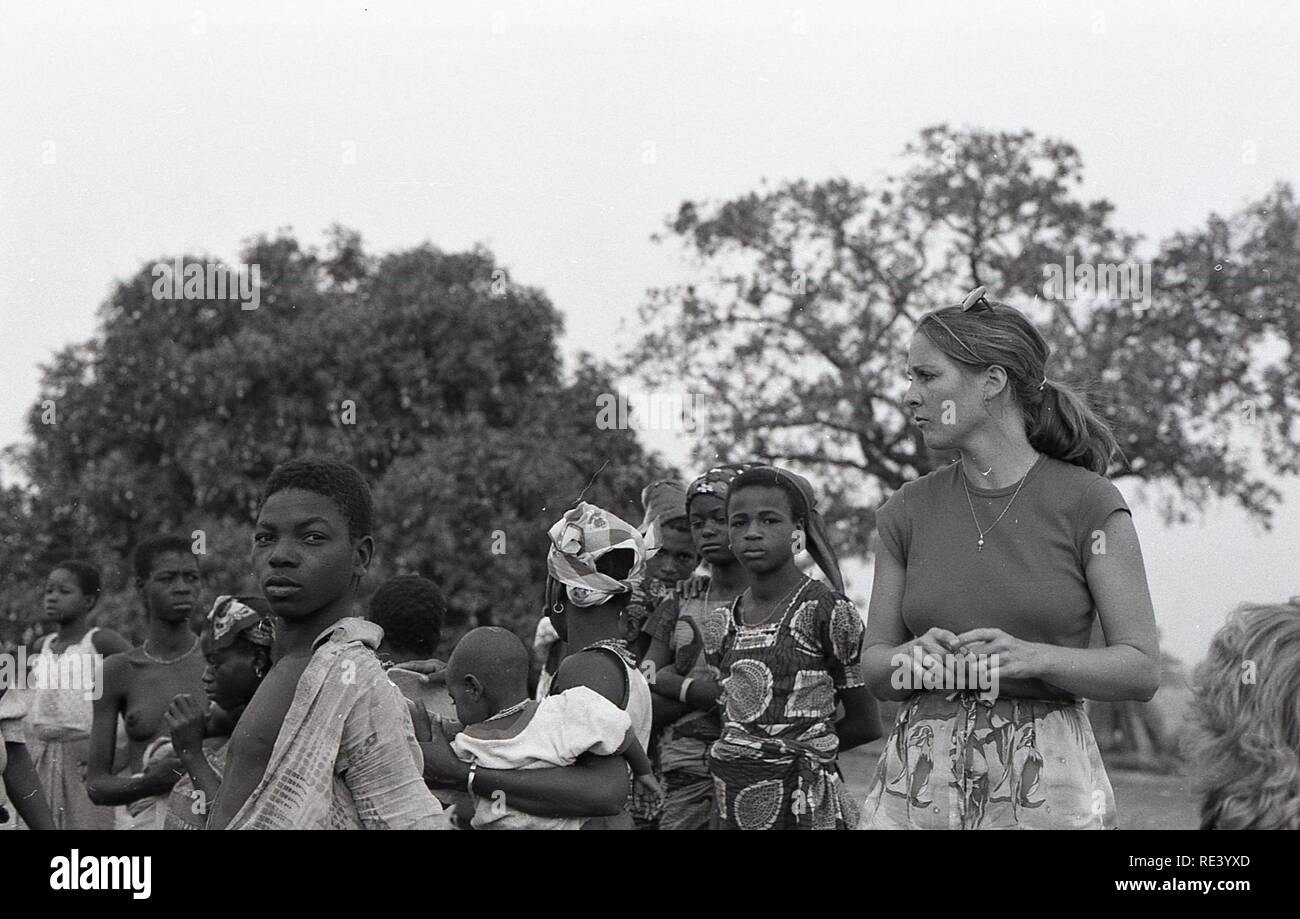 WOMAN OBSERVING WOMEN AND CHILDREN Stock Photo - Alamy