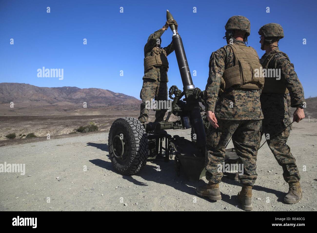 Marines with Battery B, 1st Battalion, 11th Marine Regiment, load an ...