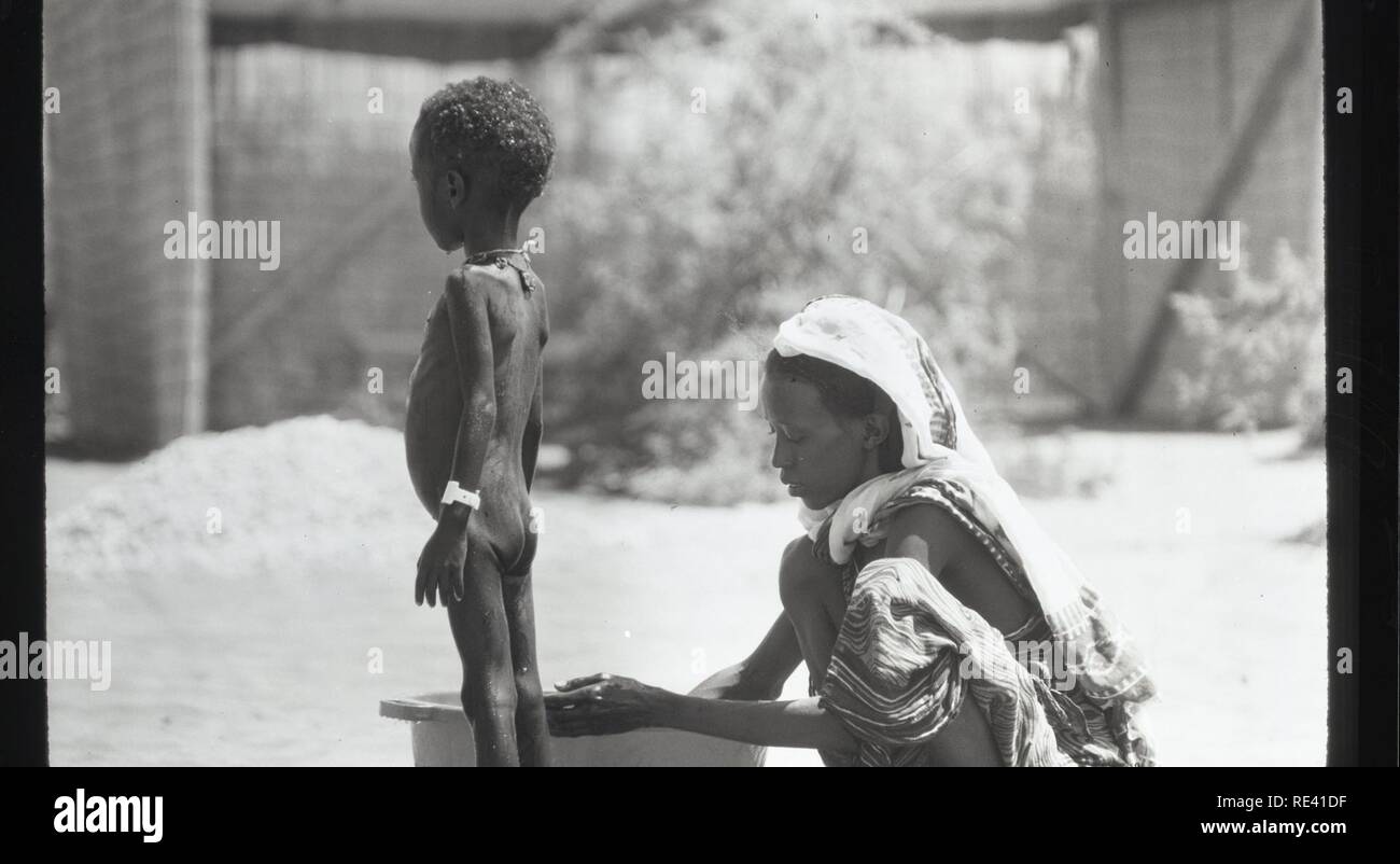 WOMAN BATHING YOUNG BOY Stock Photo - Alamy