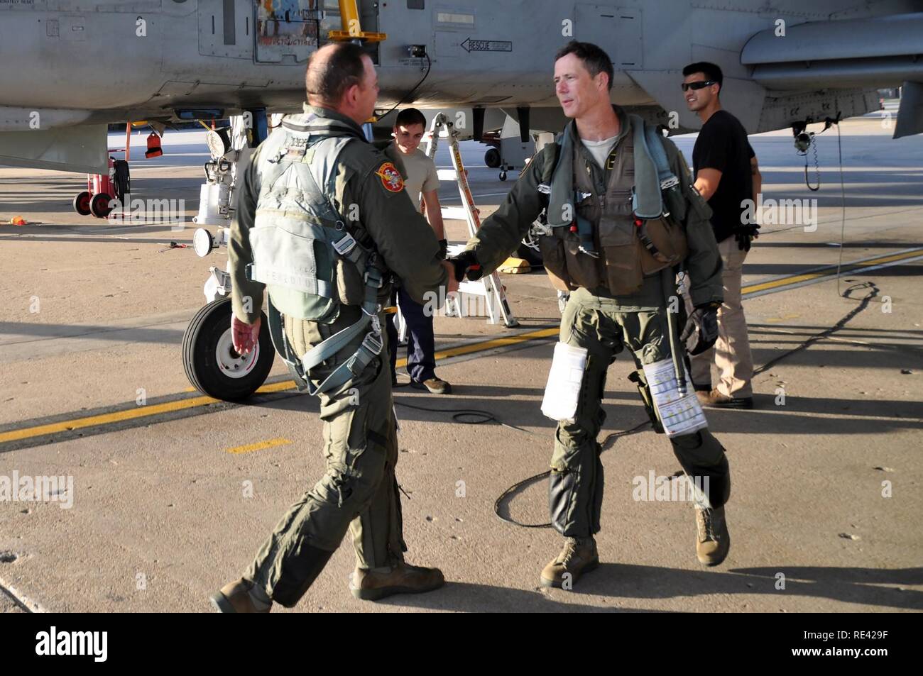 Lt. Col. John Marks, right, a pilot with the 303rd Fighter Squadron ...
