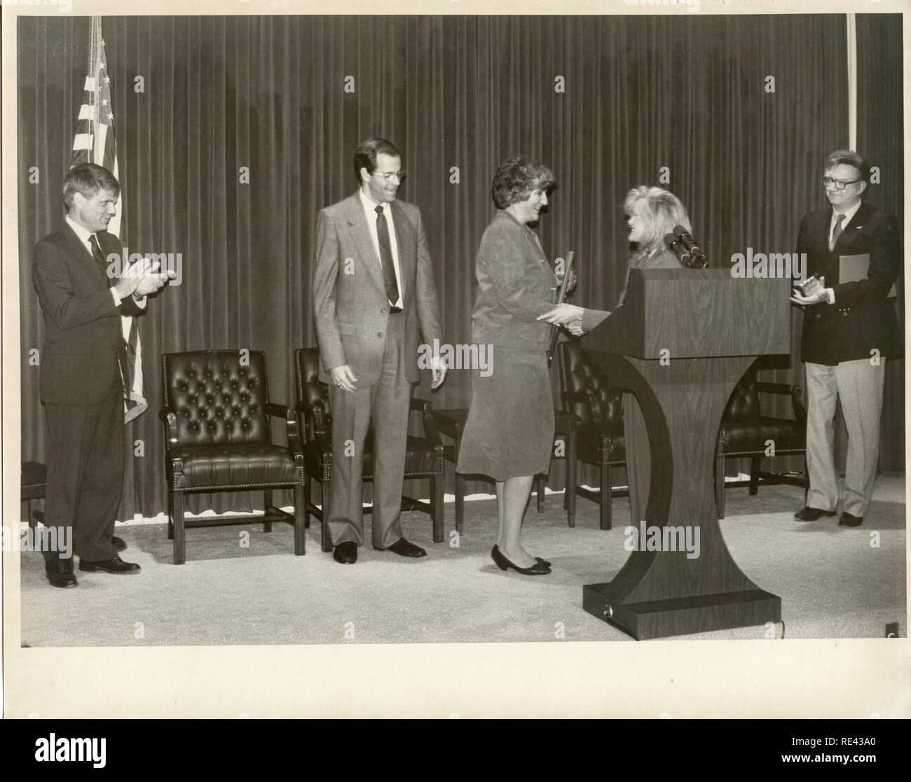 WOMEN SHAKING HANDS ON STAGE Stock Photo - Alamy