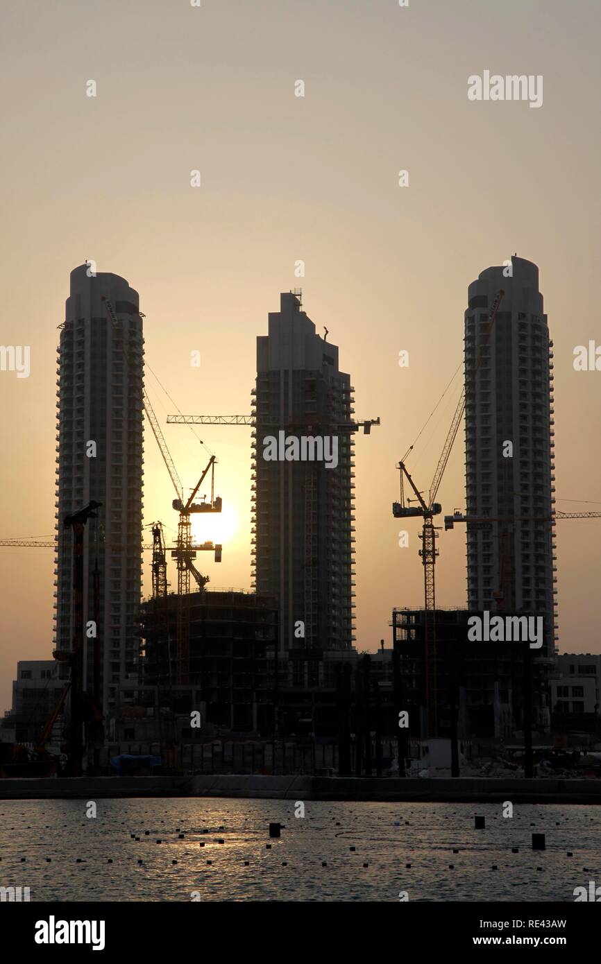 High-rise construction sites at the lake of Downtown Dubai, United Arab ...