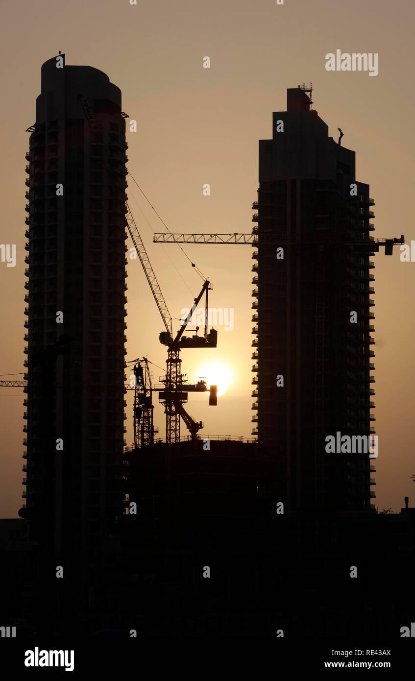 High-rise construction sites at the lake of Downtown Dubai, United Arab ...