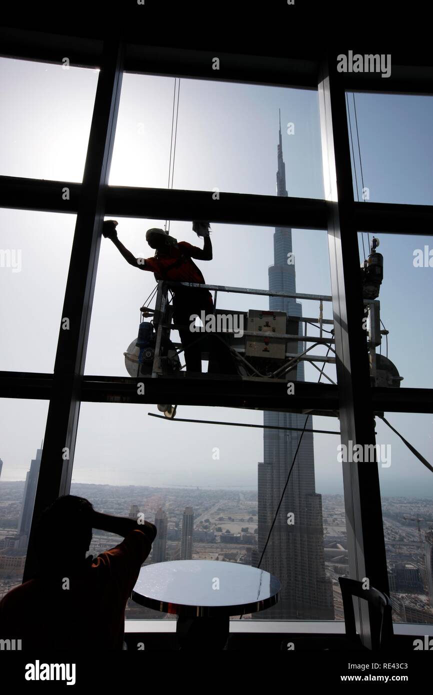 Window cleaner on the 63rd floor of the luxury hotel The Address, Neos ...