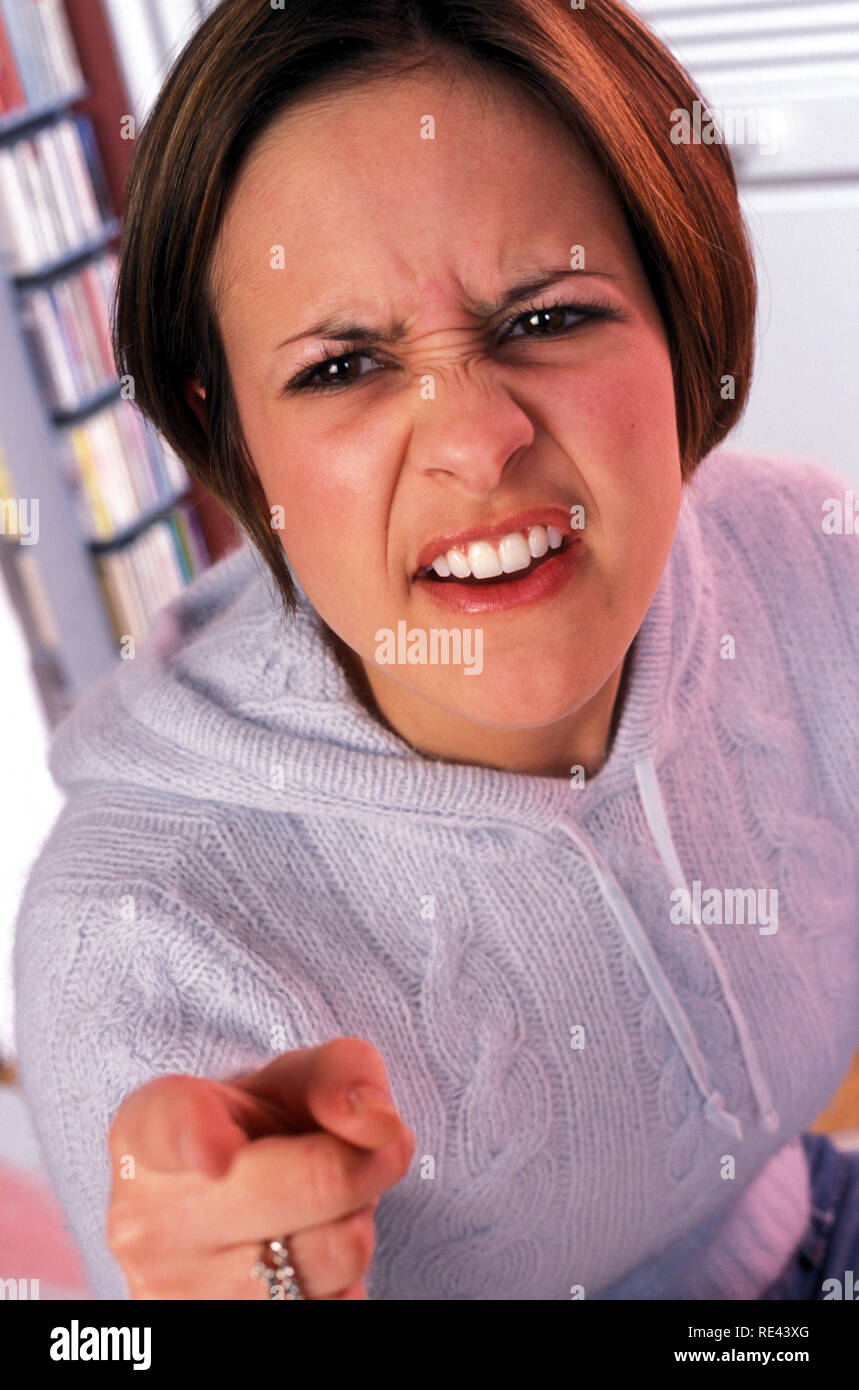 Angry young woman pointing finger, USA Stock Photo - Alamy