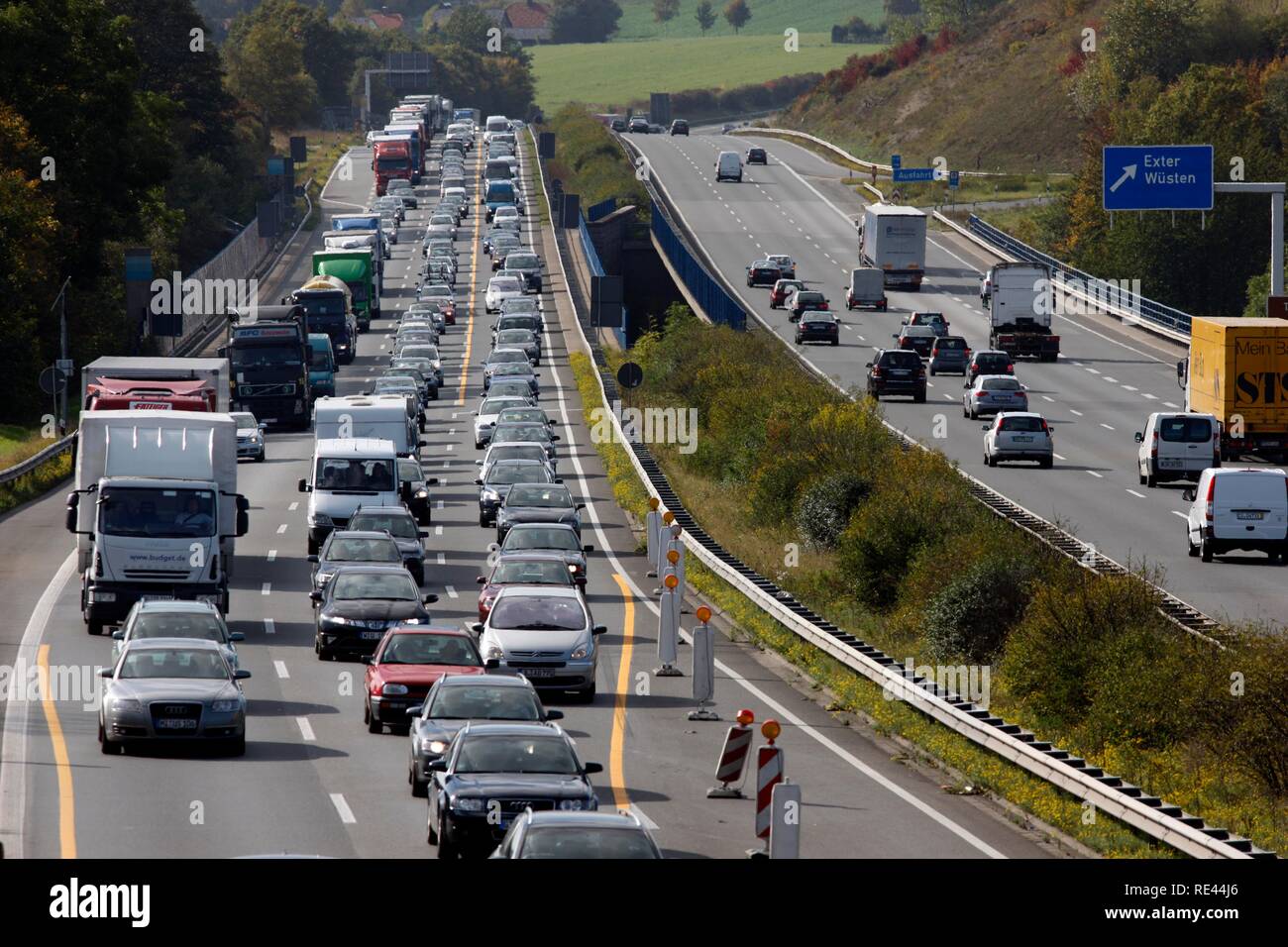 Traffic jam in the reduction of 3 to 2 lanes at a highway construction ...