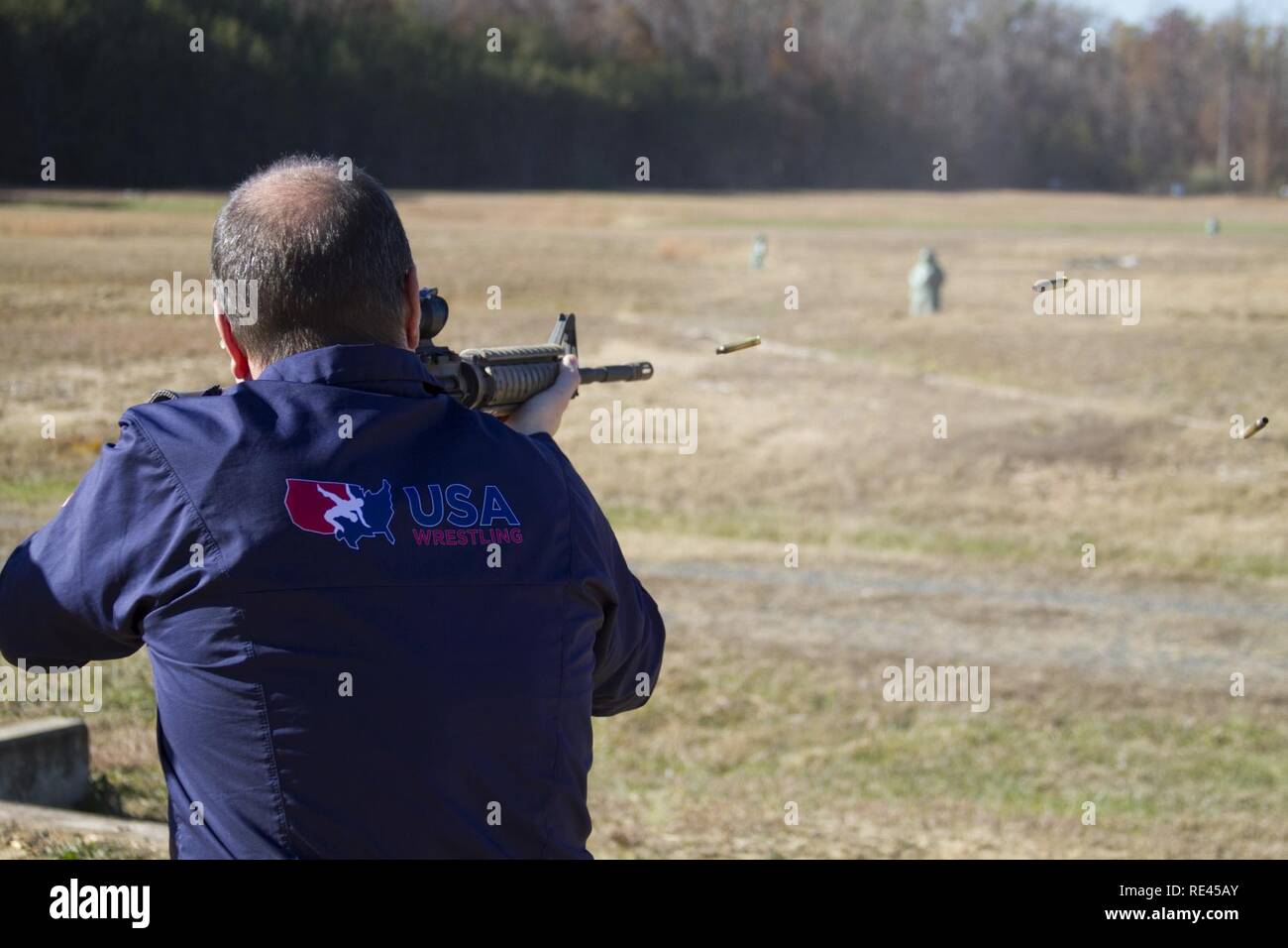 Rich Bender, executive director, USA Wrestling, fires rounds down range ...