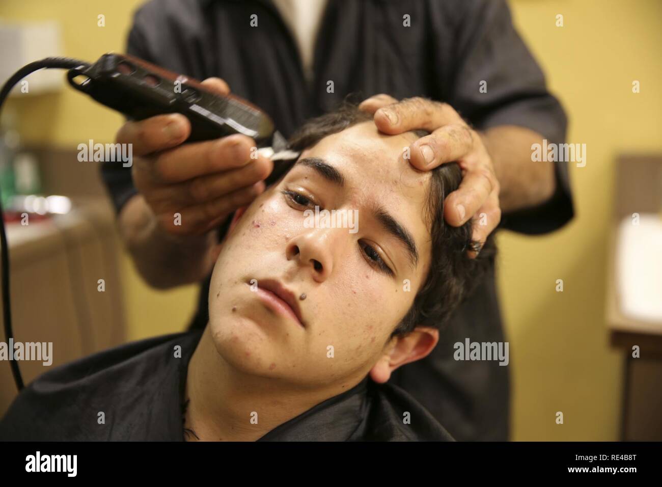 A recruit from India Company, 3rd Recruit Training Battalion, receives ...
