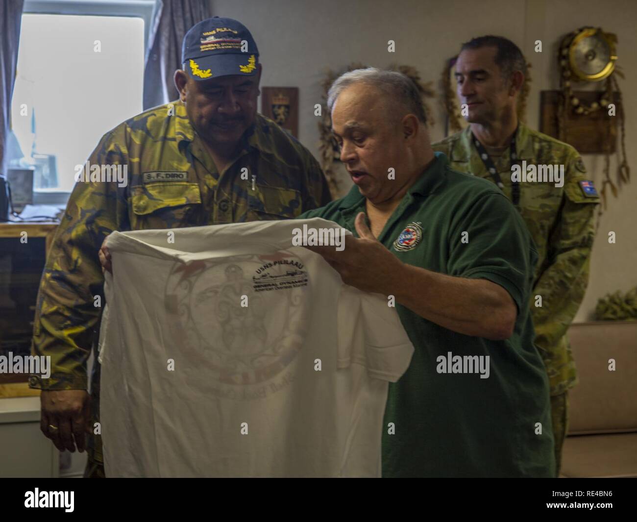 Contracted mariner Capt. Tom Madden, center, master of maritime ...