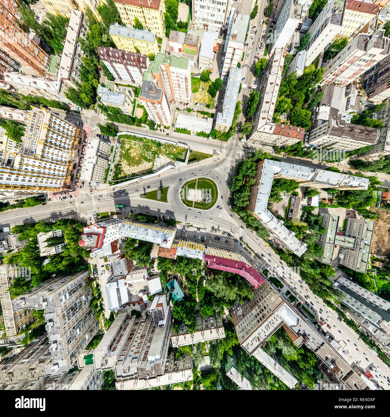 Aerial city view with crossroads and roads, houses, buildings, parks ...