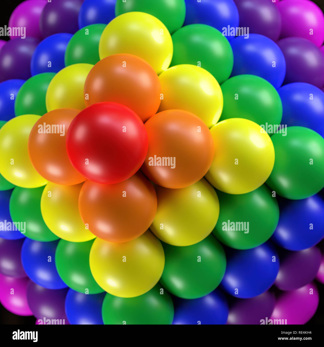 3D render of pyramid formed from balls in rainbow colors viewed from ...
