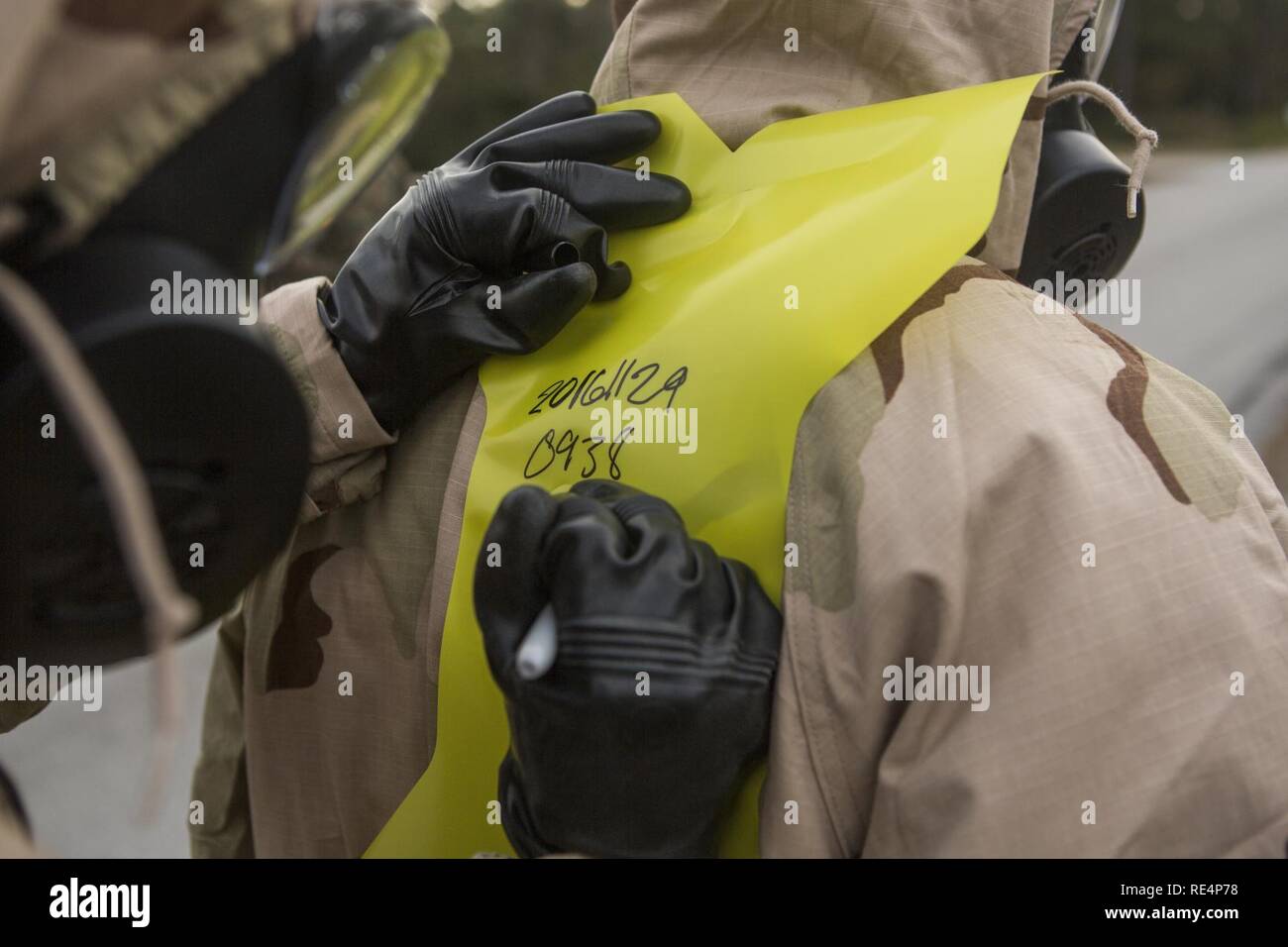 U.S. Marine Corps Sgt. Christian M. Nelson, left, a chemical ...