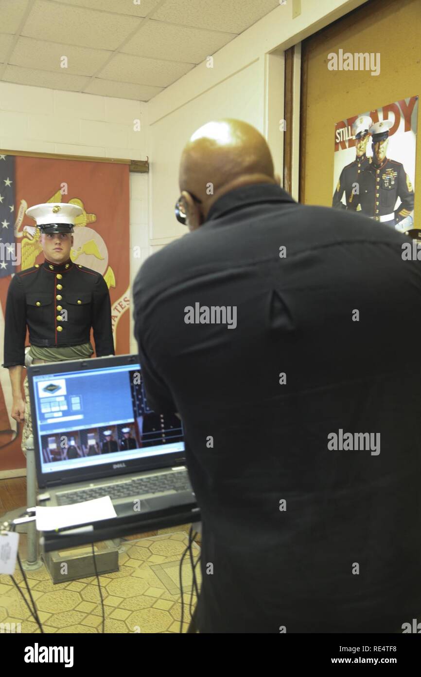 Christopher Deans, a Recruit Photographer, takes an official photo of a ...