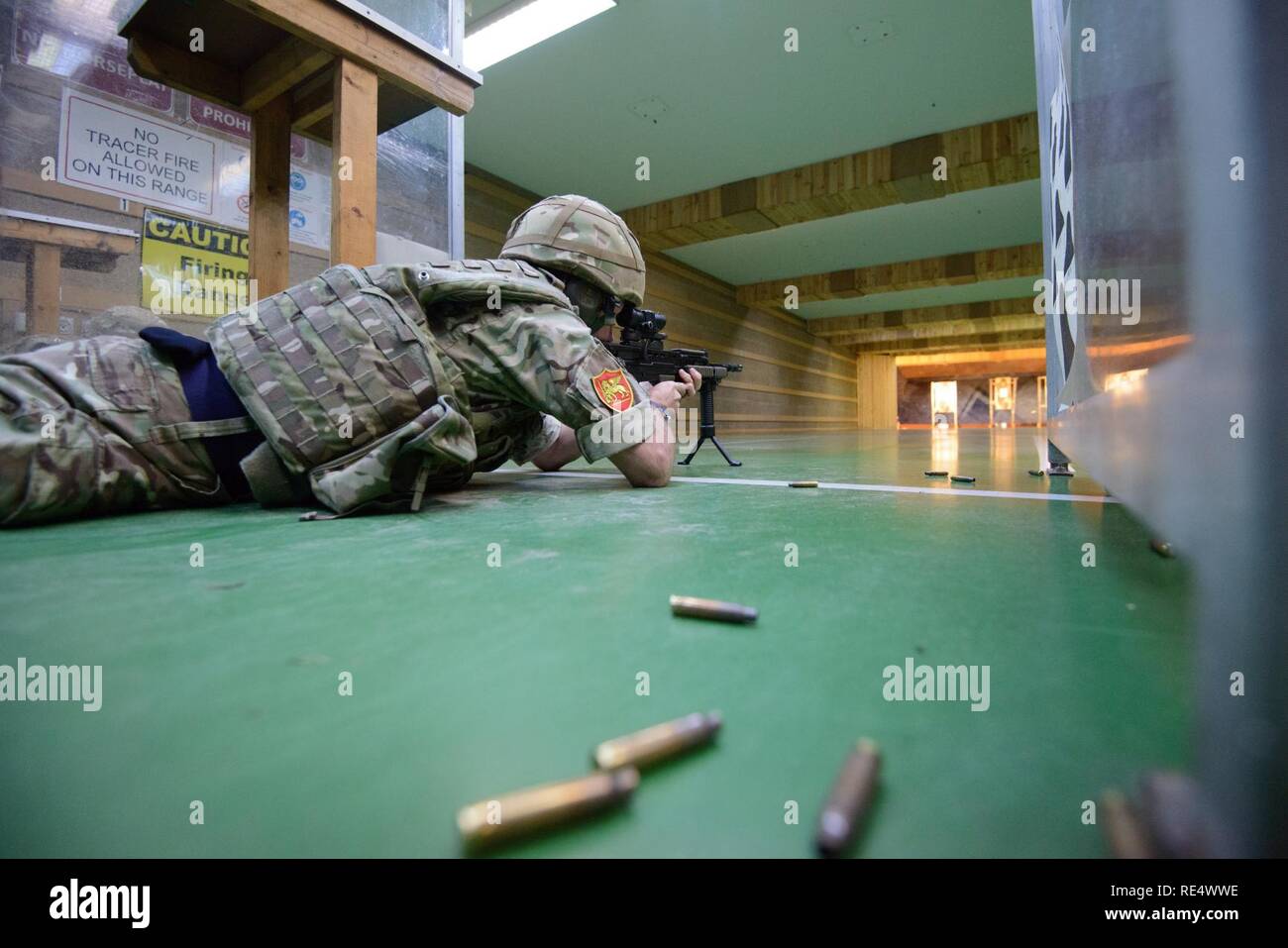 A member of the Royal Navy fires an L85 A2 Rifle at the Training ...