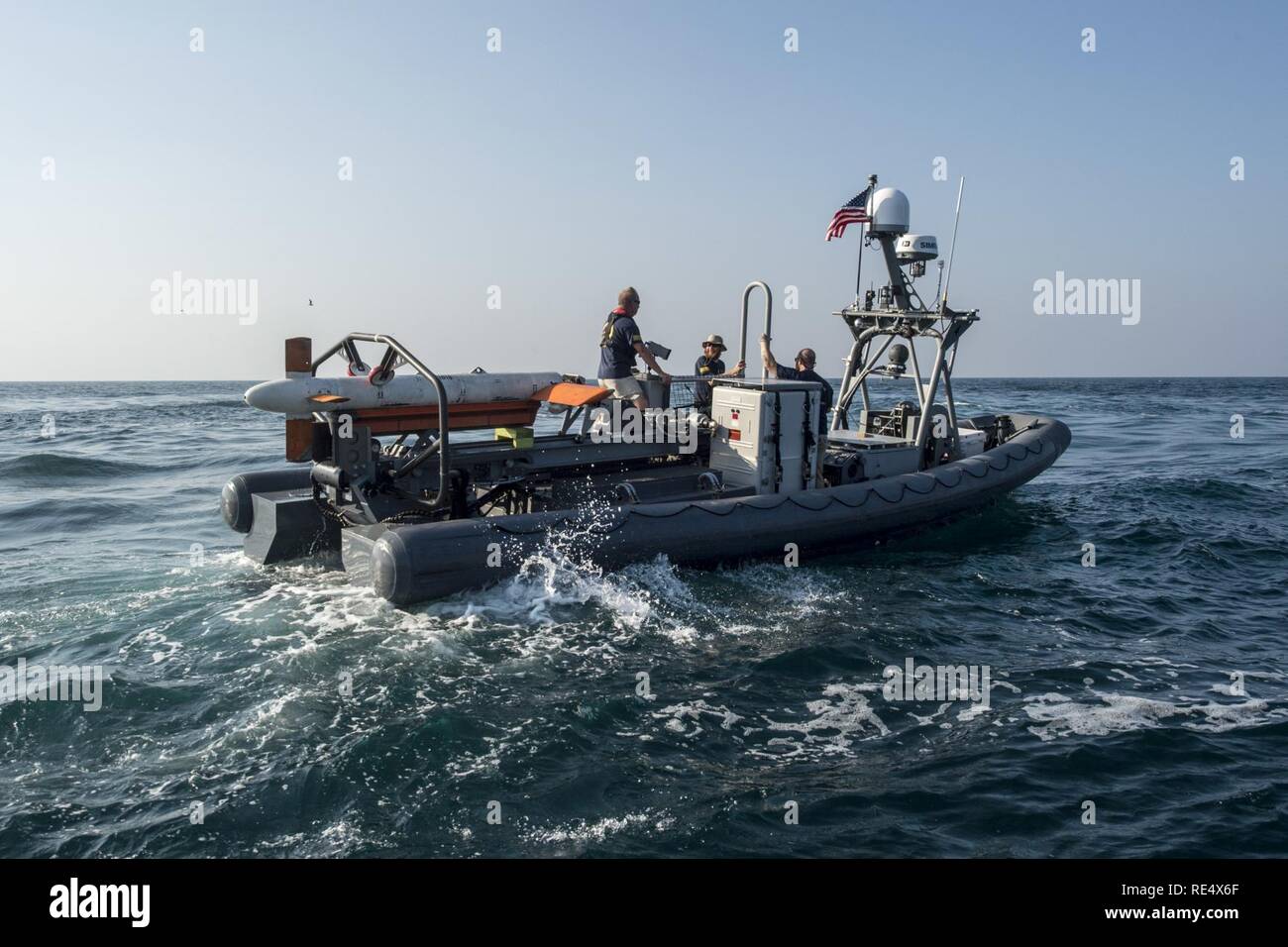 U.S. contractors with the Navy Mine Hunting Unit (MHU) test a common ...