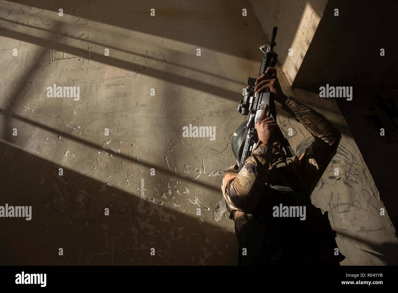 An Iraqi Counter-Terrorism Service soldier clears upward while ...