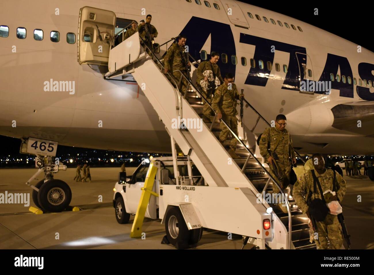 Soldiers assigned to the 176th Engineer Company deplane after arriving ...