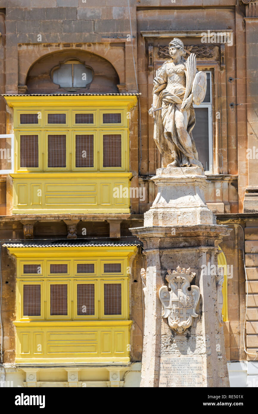 Victory Square statue with historic architecture in Birgu, Malta Stock ...