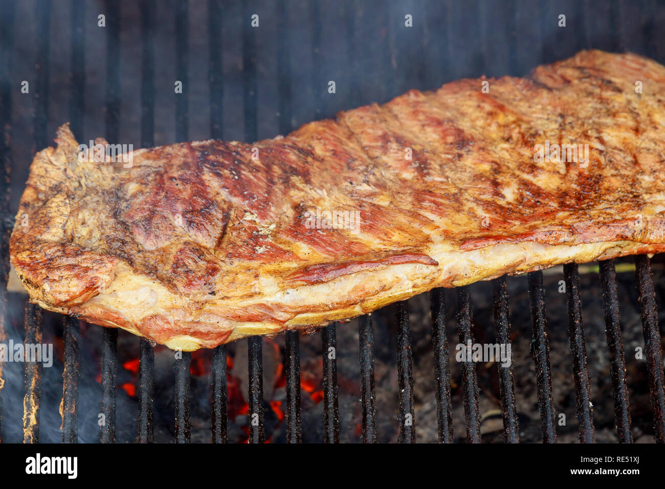 Delicious grilled barbecue pork ribs on hot flaming grid Stock Photo ...