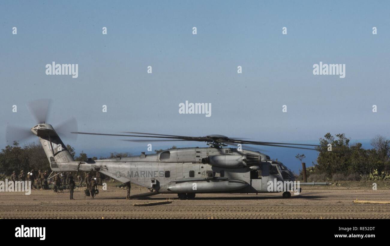Marines with Marine Wing Support Squadron (MWSS) 373 begin to unload ...