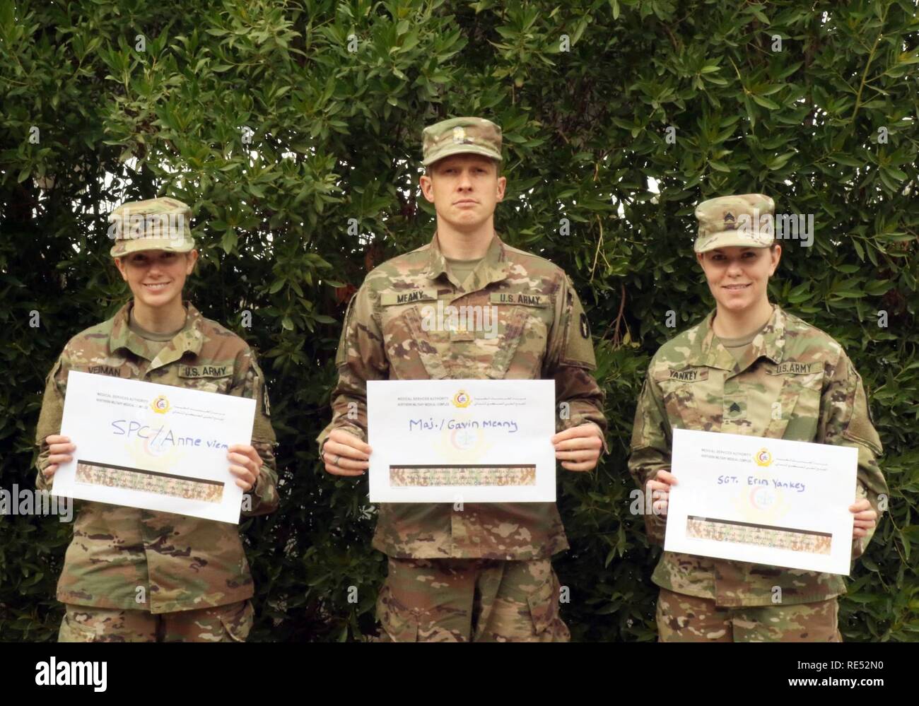 Spc. Anne Veiman, Maj. Gavin Meany, and Sgt. Erin Veiman display ...