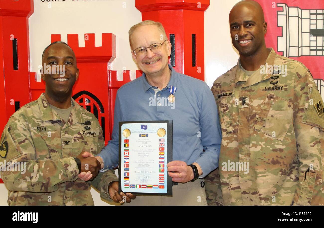 Mark A. Coburn is beaming with pride as he is presented the NATO medal ...