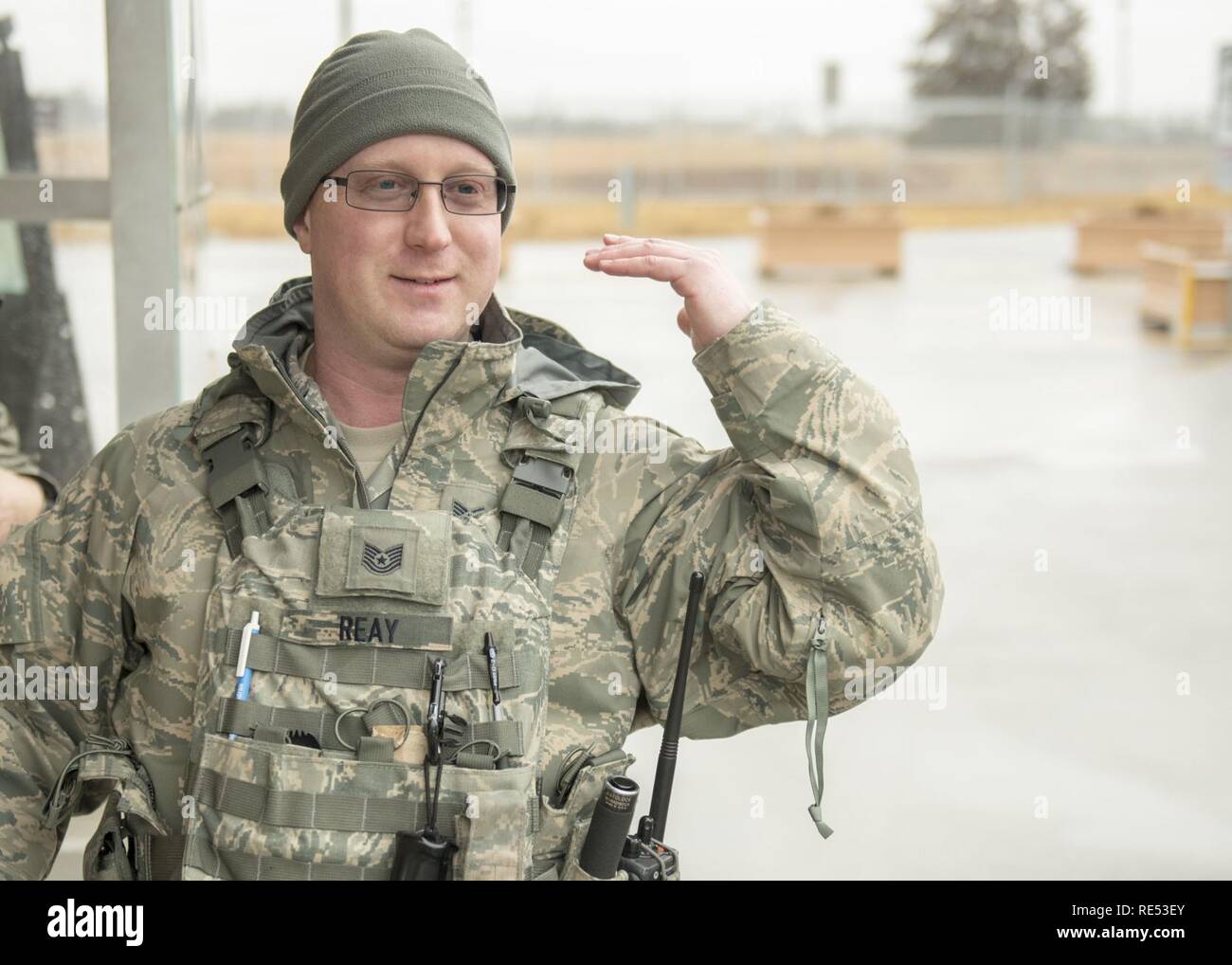 Technical Sgt. Wayne Reay of the 102nd Security Forces Squadron checks personnel identification ...