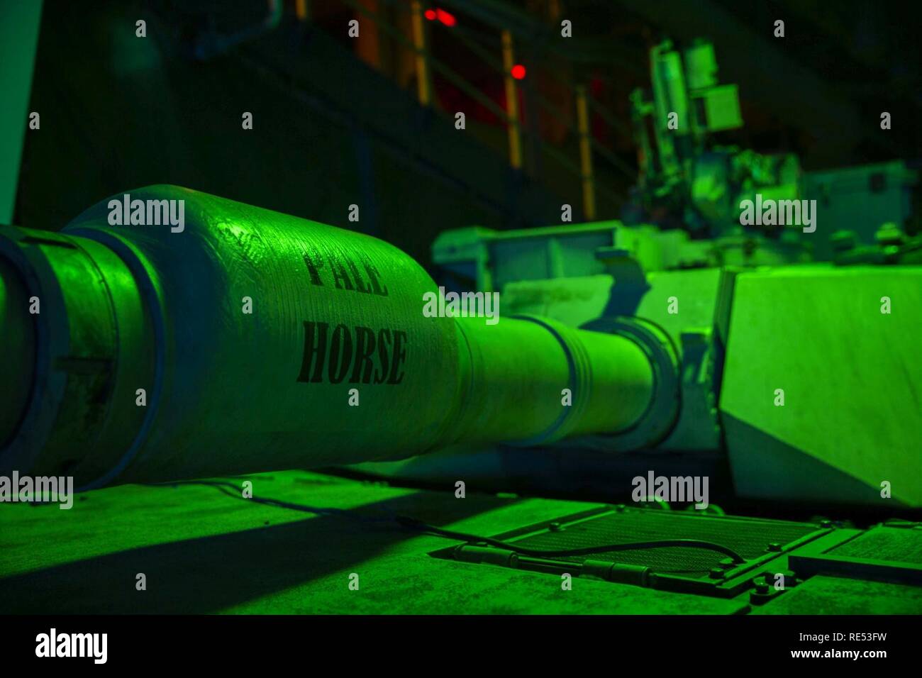A M1A1 Abrams tank is stored in the well deck of the USS Kearsarge (LHD ...