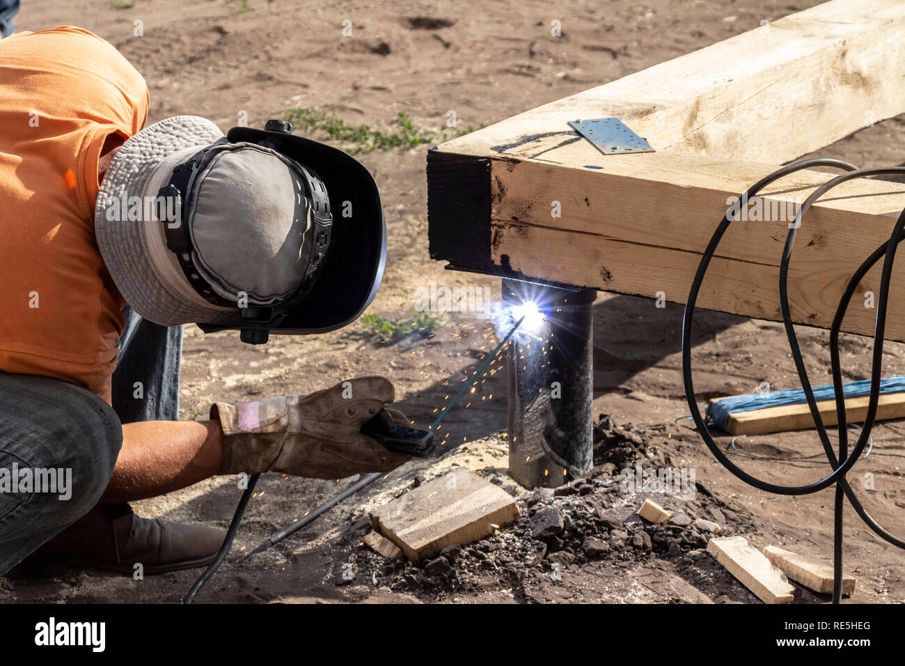 The welder works on the construction site when installing the ...
