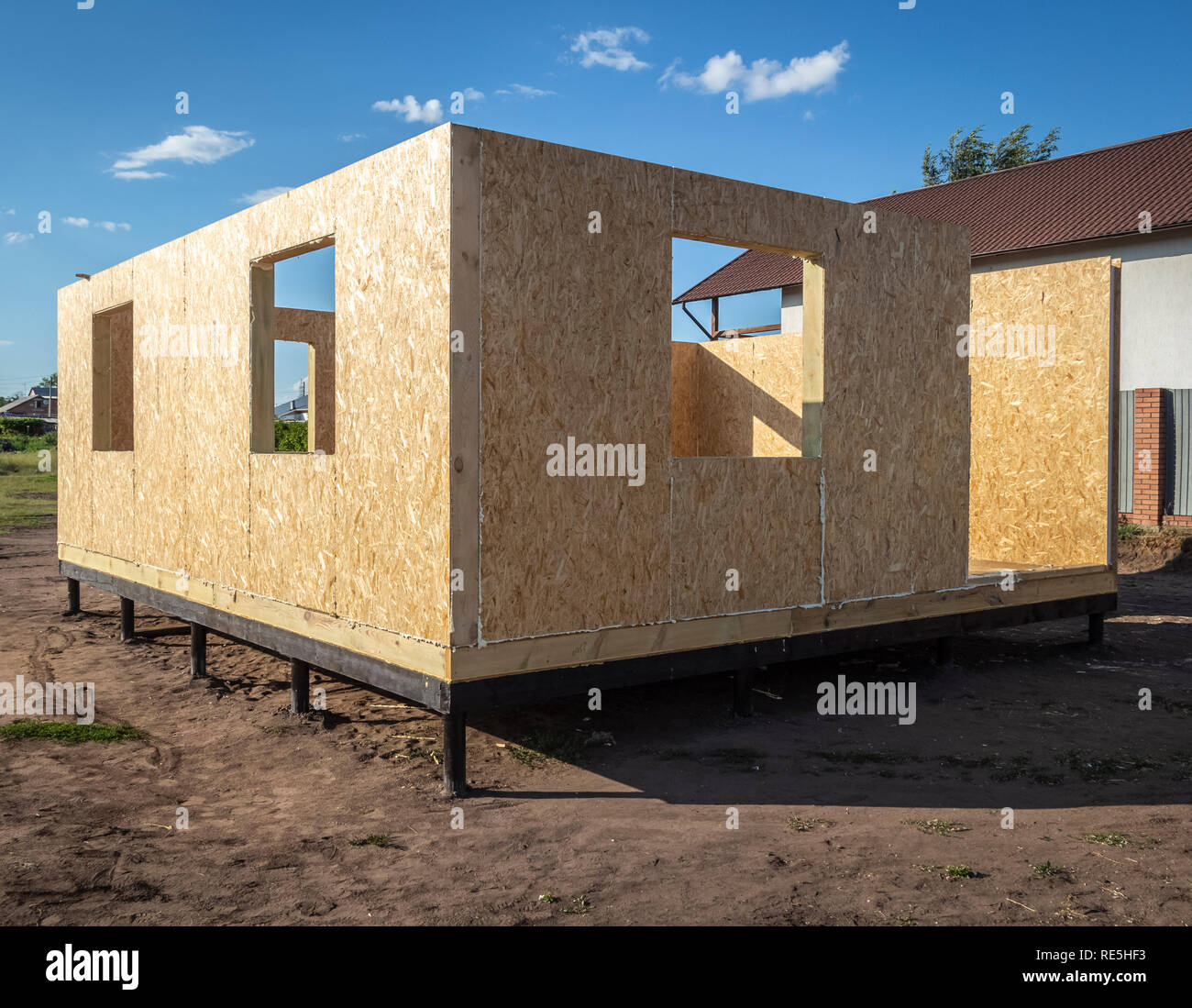 Construction of a wooden house of SIP panels Stock Photo - Alamy