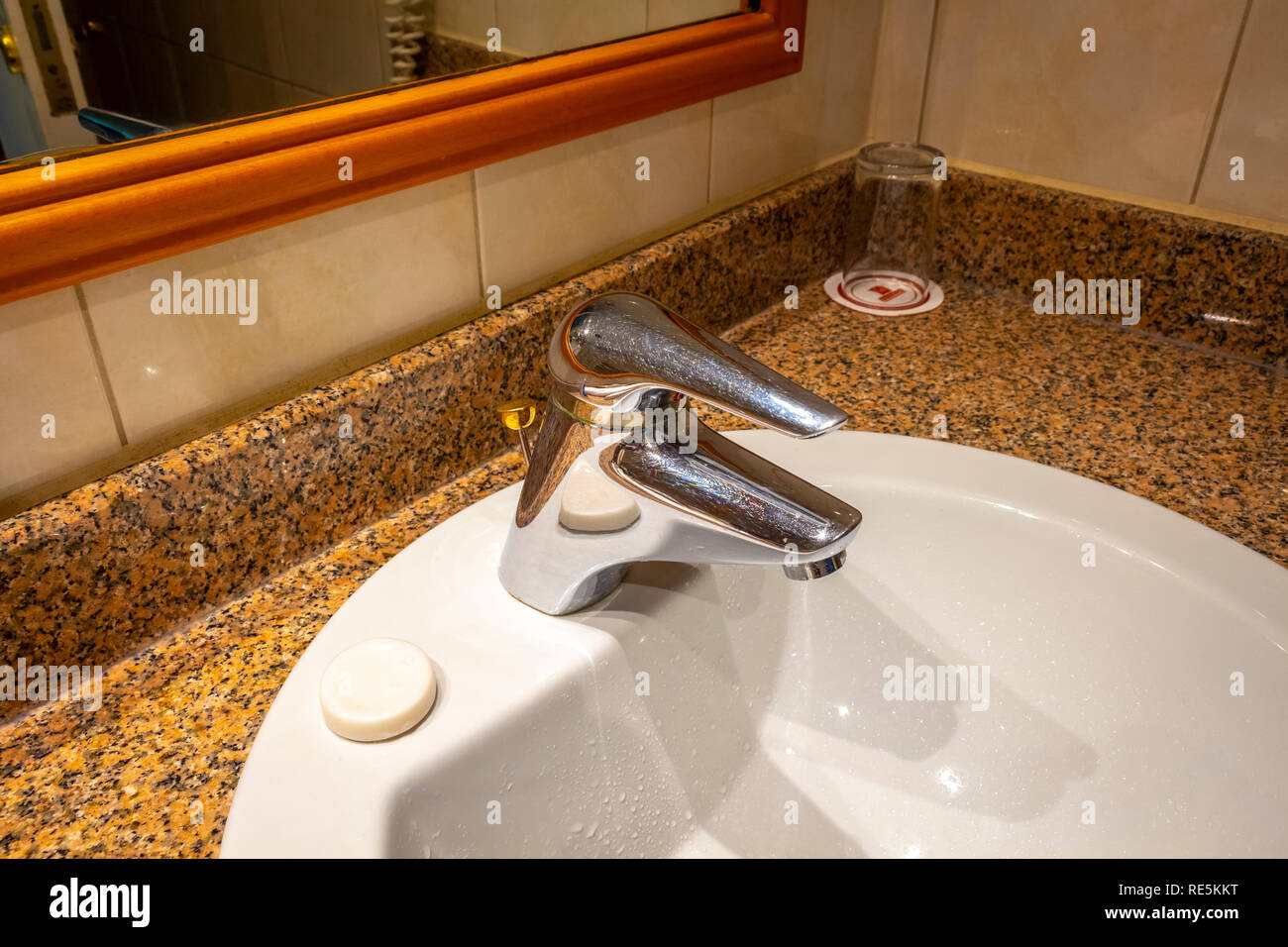 Modern sink with faucet in the bathroom of the hotel room Stock Photo ...
