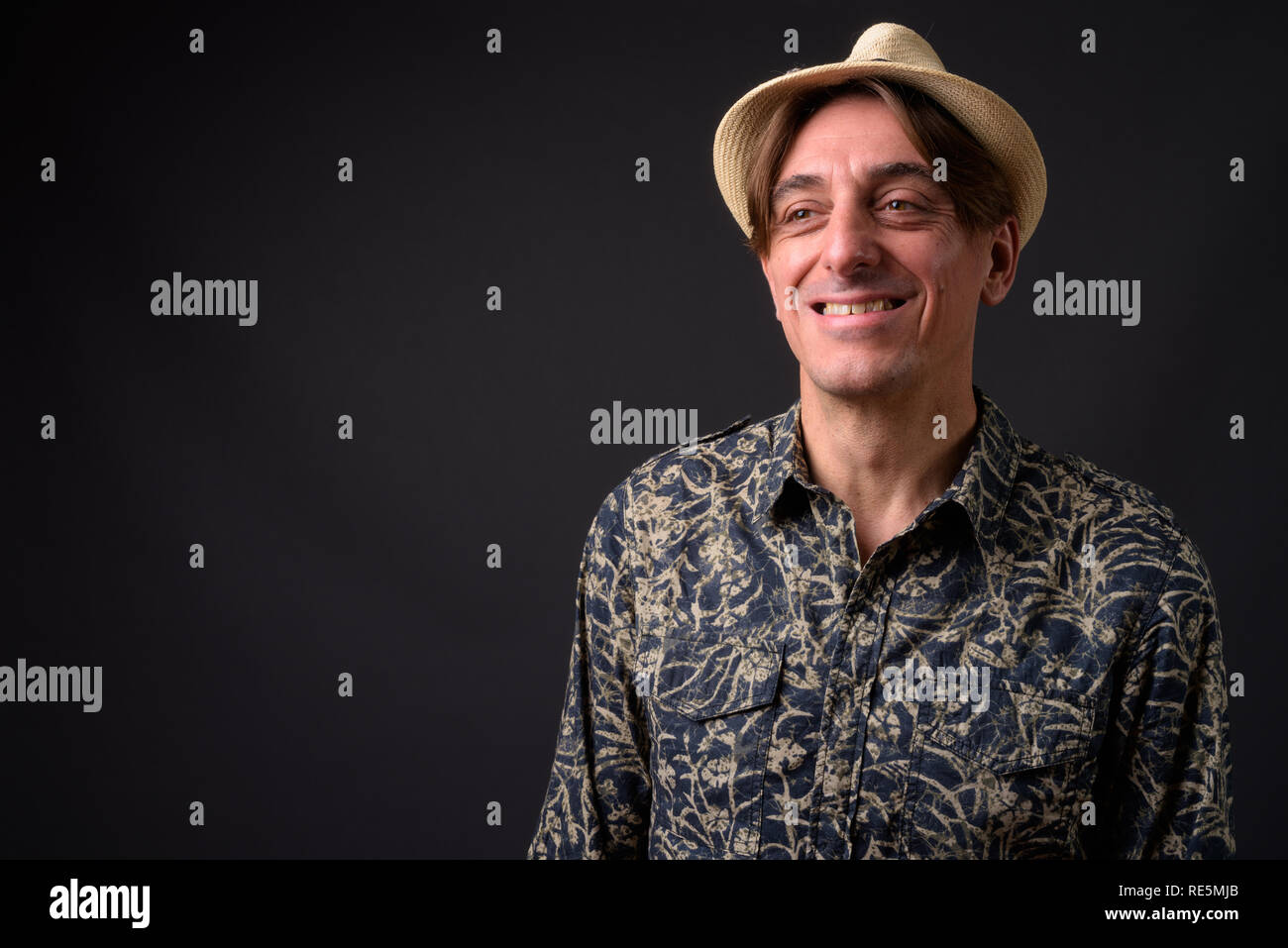 Mature handsome Italian tourist man smiling and laughing Stock Photo ...