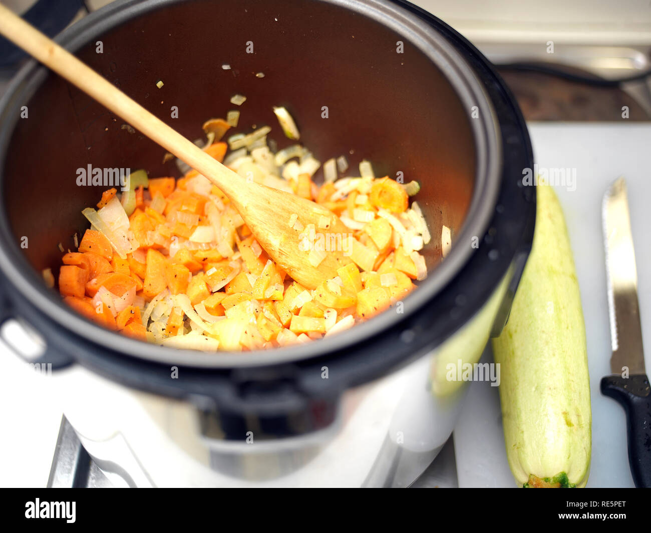 Cooking vegetable mix in a casserole, indoor closeup Stock Photo - Alamy