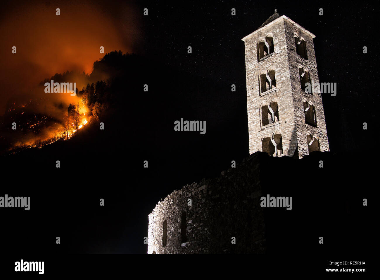 The old medieval castle of Mesocco and forest on fire Stock Photo - Alamy