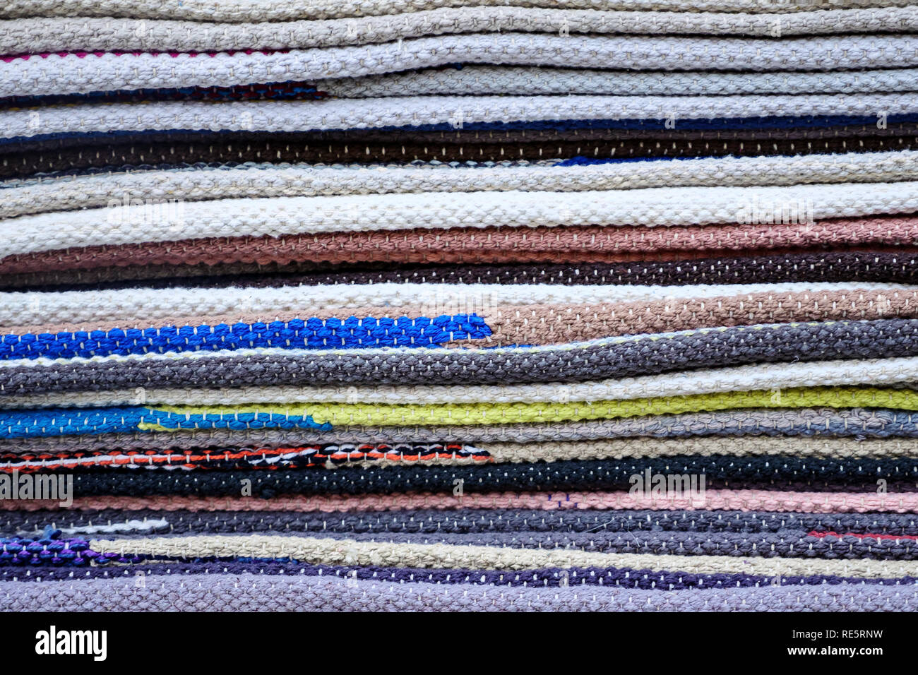 Assorted pieces of fabric in shop Stock Photo - Alamy