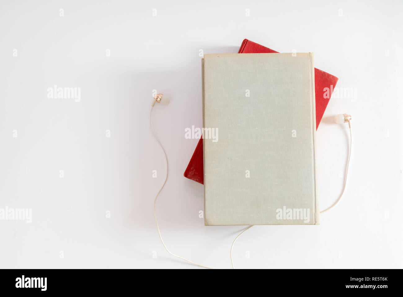 Audio book concept. Headphones and book over white table background ...
