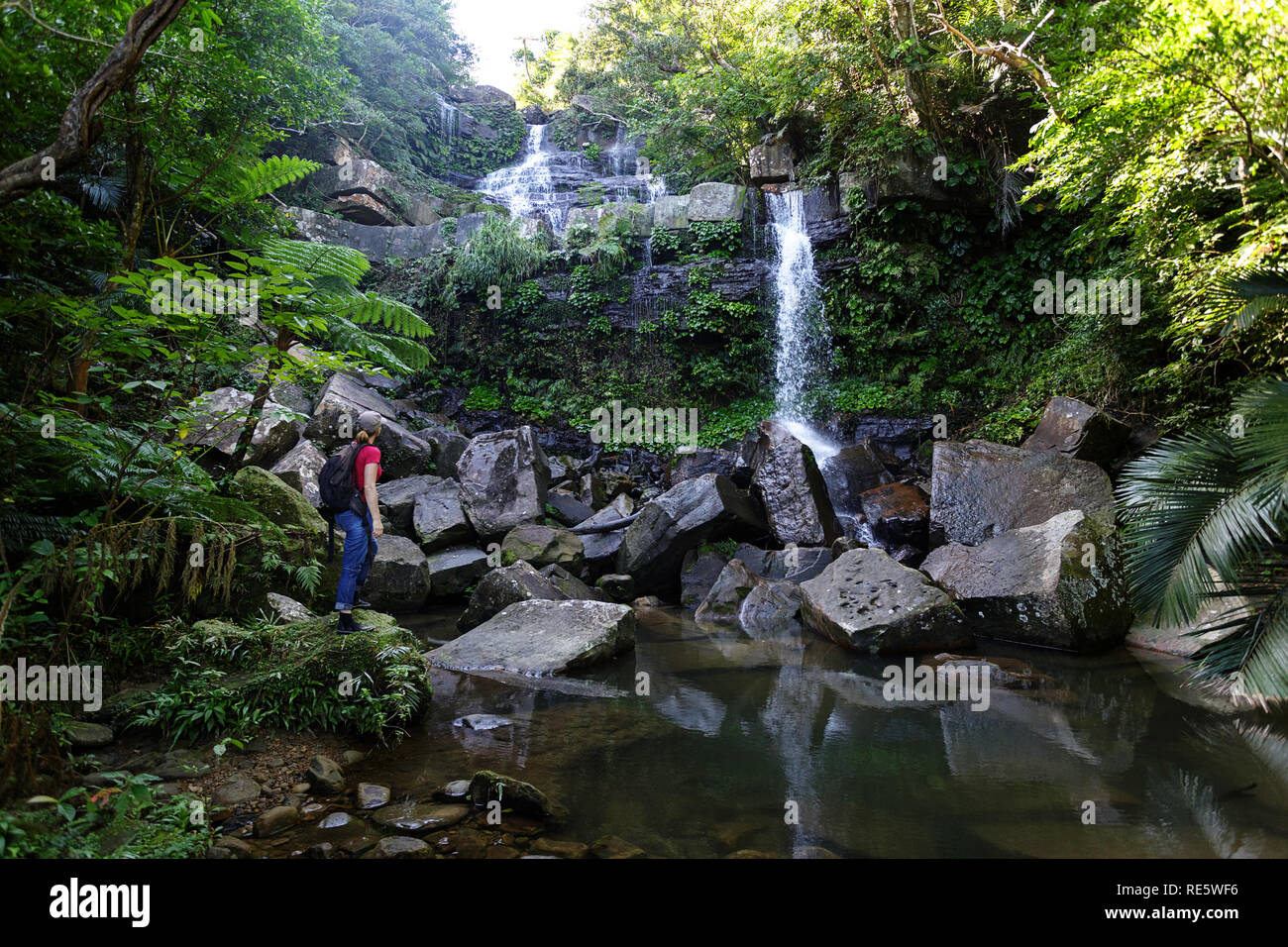 Woman under waterfall hi-res stock photography and images - Alamy