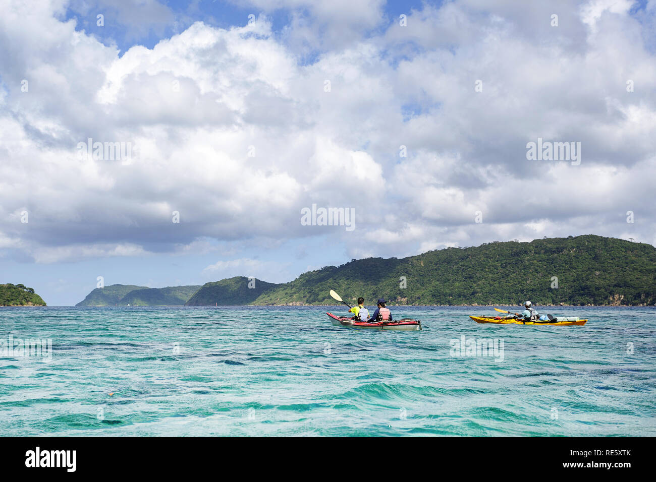 Group of kayakers on a kayaking expedition at tropical islands Stock ...