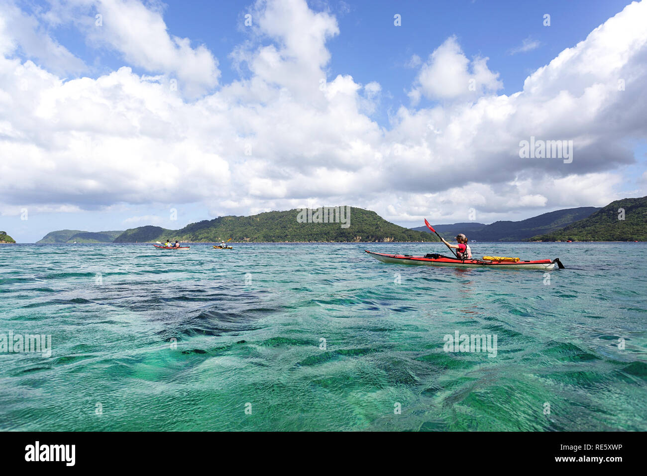 Group of kayakers on a kayaking expedition at tropical islands Stock ...