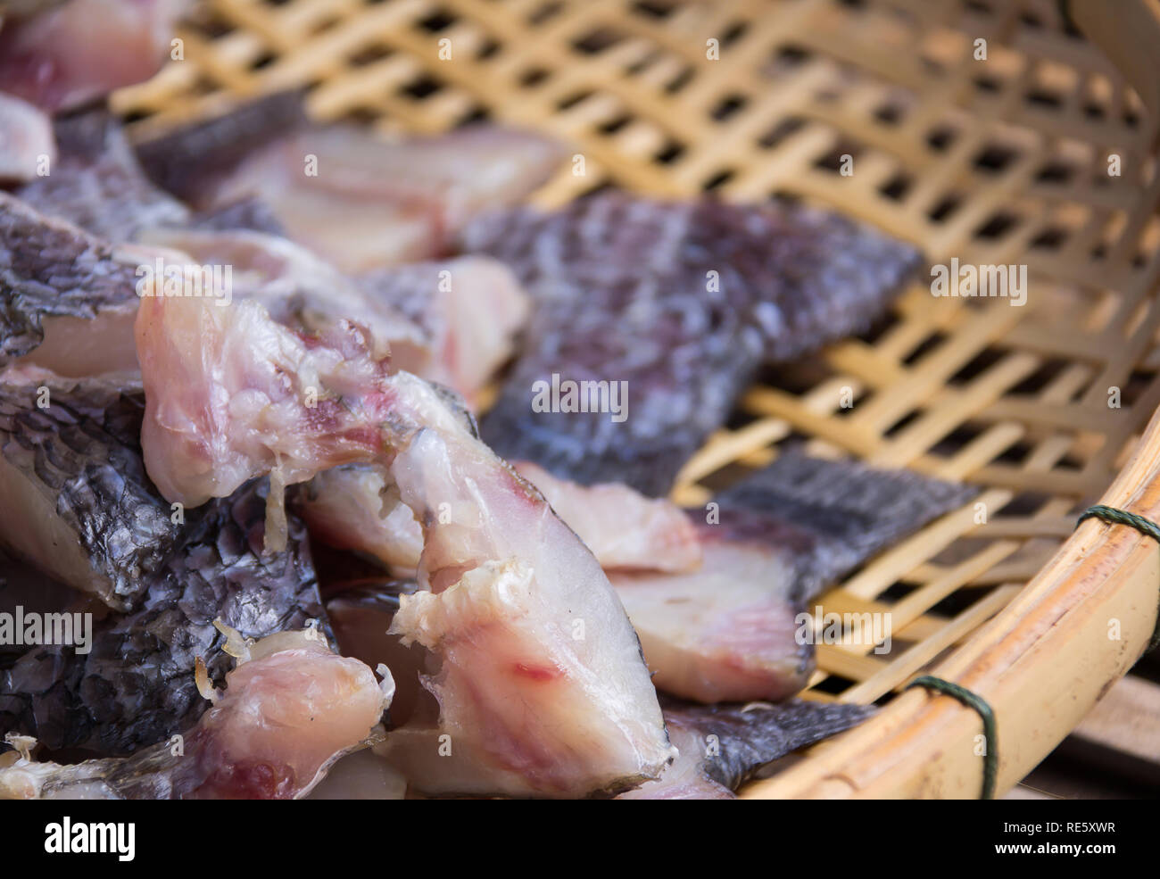 Dried sliced fish on the bamboo grid Stock Photo - Alamy