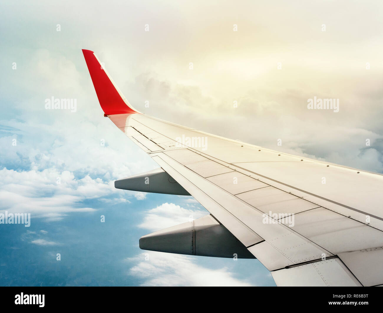 Morning sunrise with airplane wing and beautiful sky background. View ...