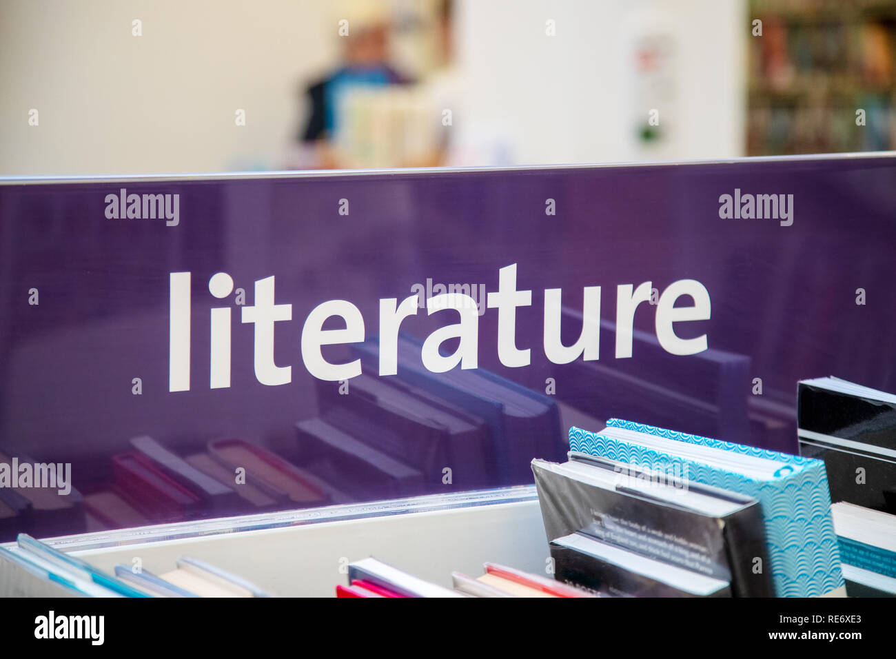 Literature sign in a public library. Close up of the top of a row of ...