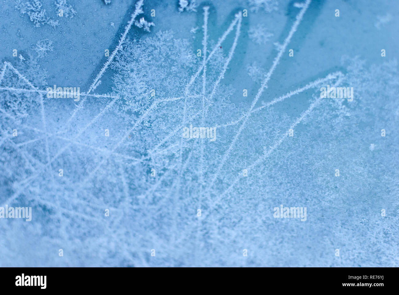 Blue ice flowers and crystals on the window Stock Photo - Alamy