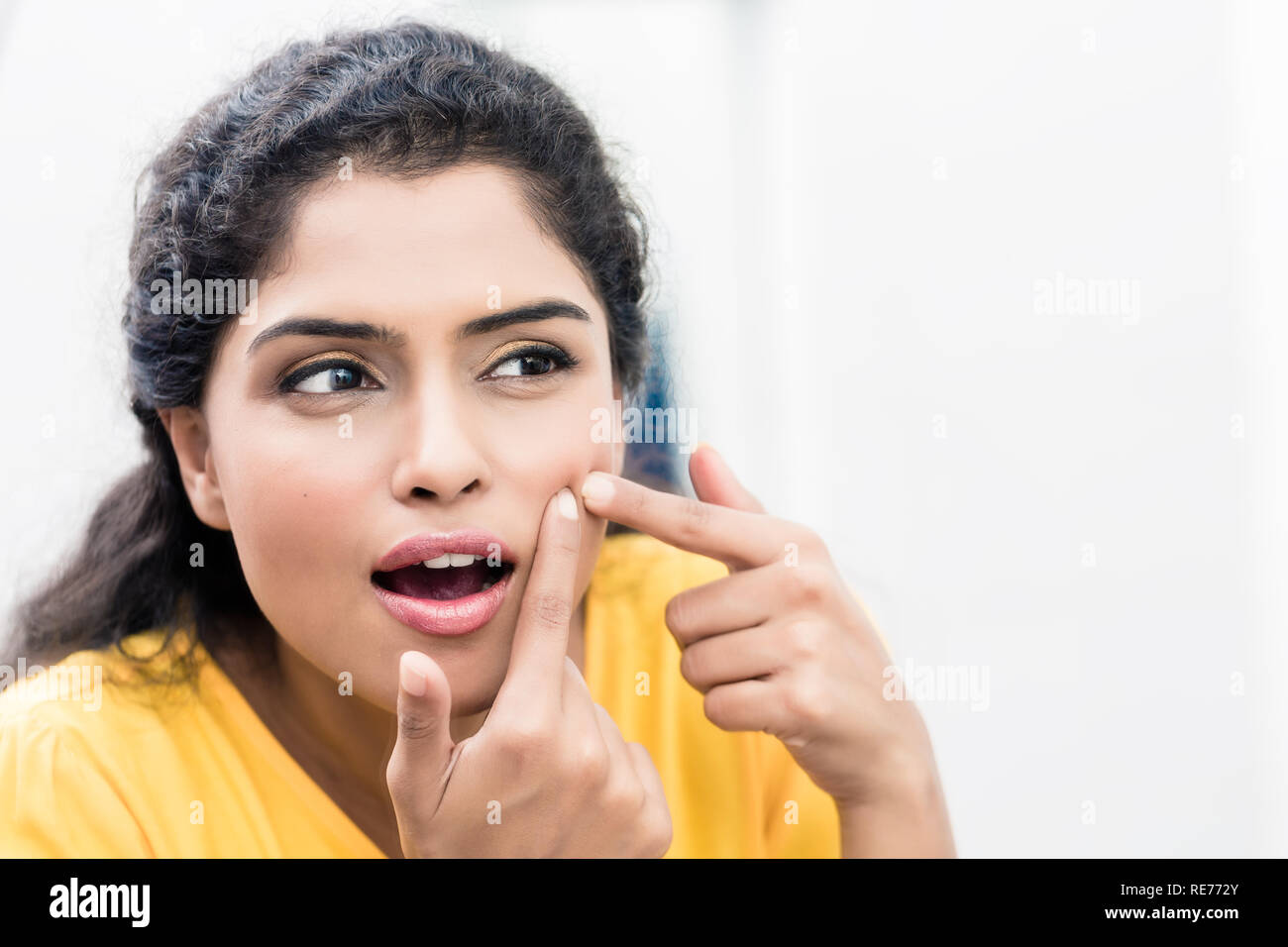 Hand squeezing face hi-res stock photography and images - Alamy