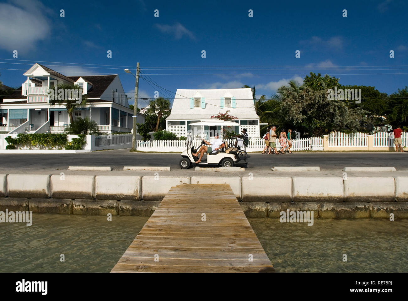 Golf car and loyalist home. Bay Street. Dunmore Town, Harbour Island ...